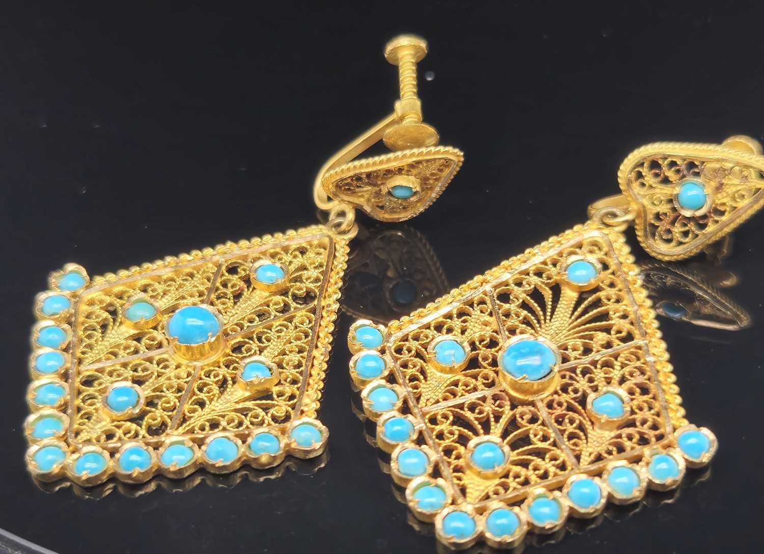 Lot 5 - A pair of antique Indian filigree and stone