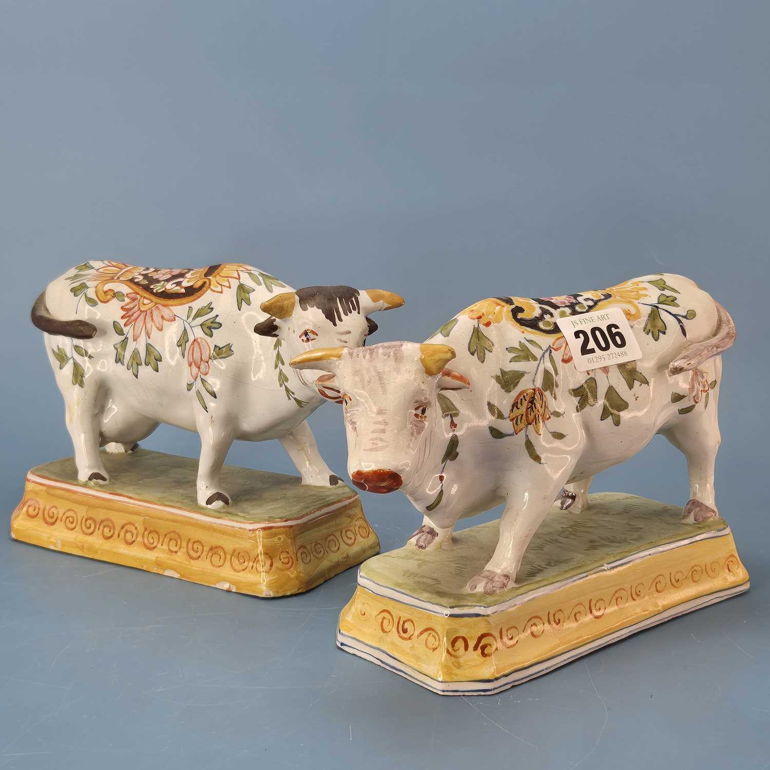 Lot 206 - A pair of 19th century polychrome Delft cows