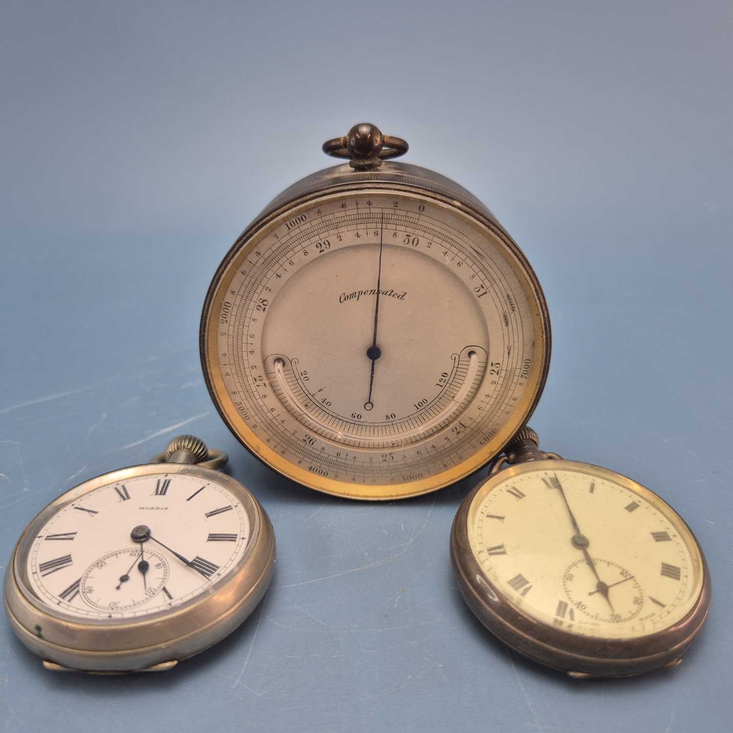 Lot 1431 - A pocket aneroid barometer, a metal cased