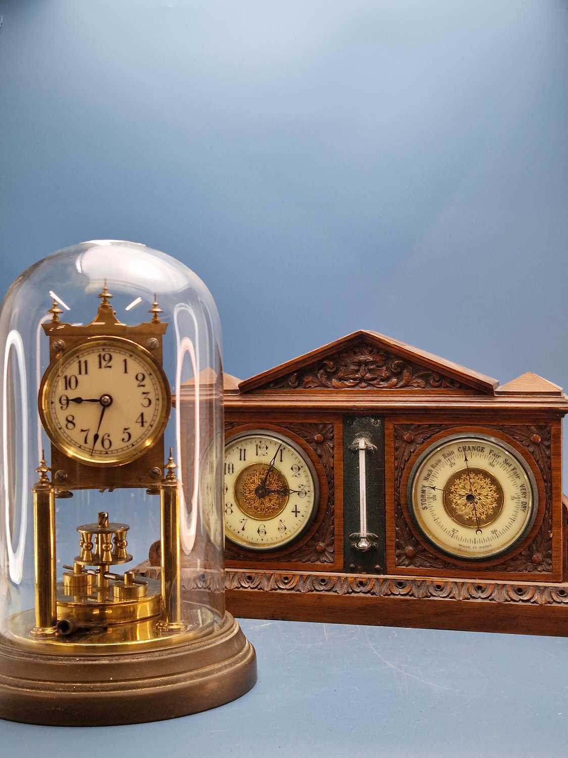 Lot 1405 - An antique oak cased desk clock/ barometer,