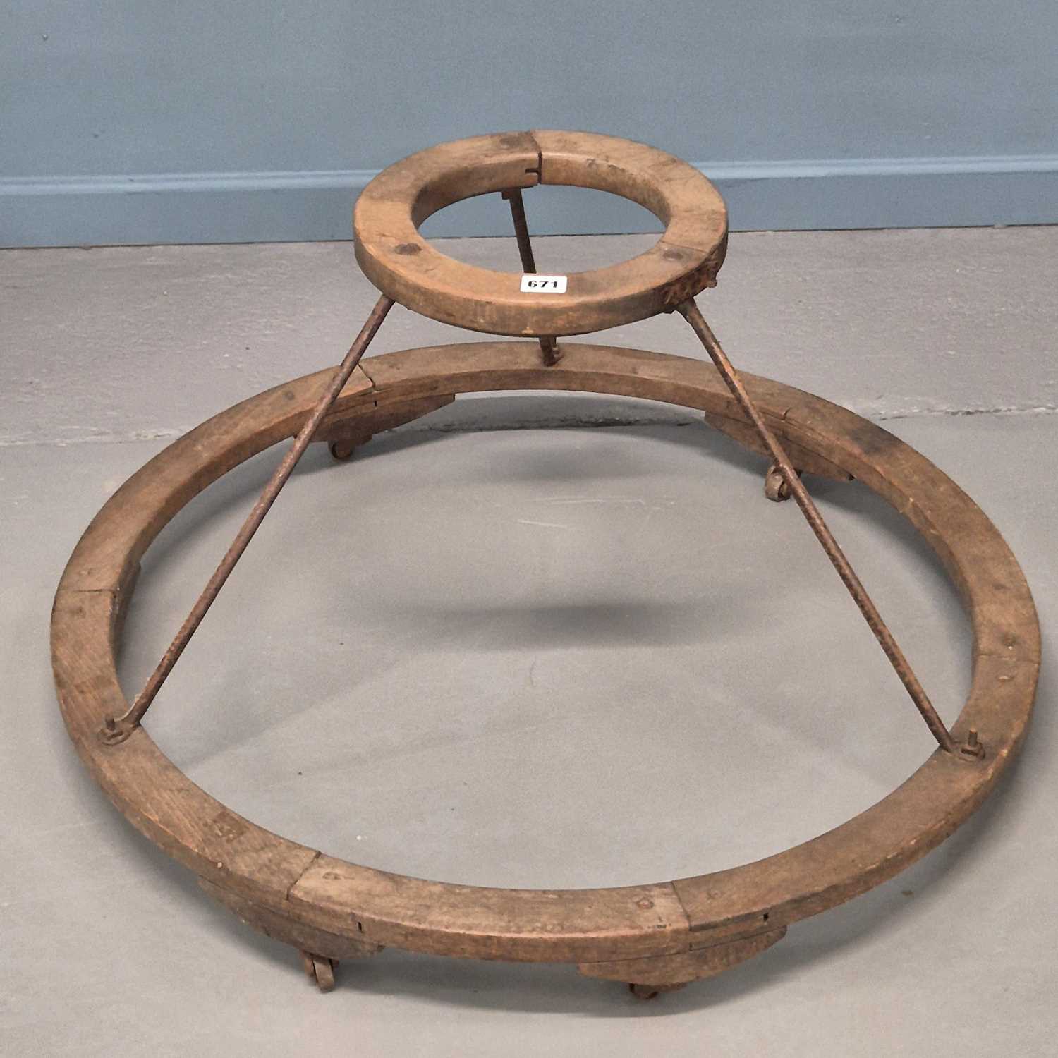Lot 671 - An 18th century wooden baby walker, the ring