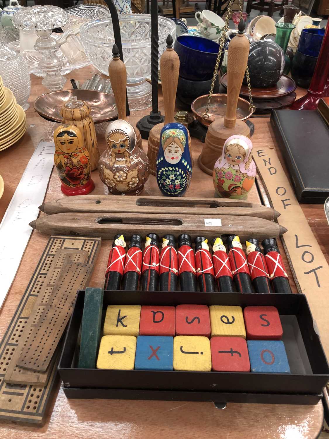Lot 506 - Three apple wood turned bells, four babushka