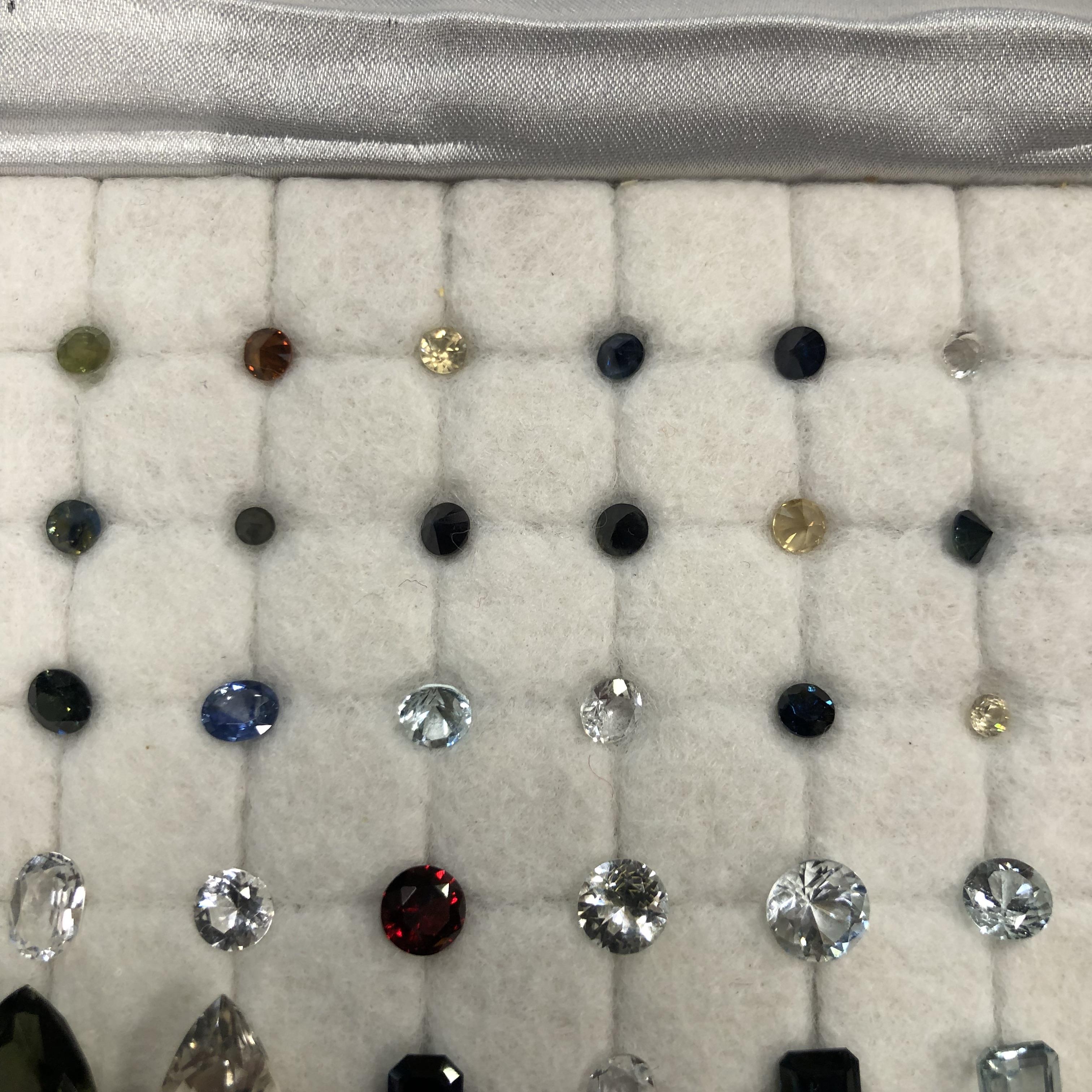 Lot 1114 - A collection of various cut gemstones,